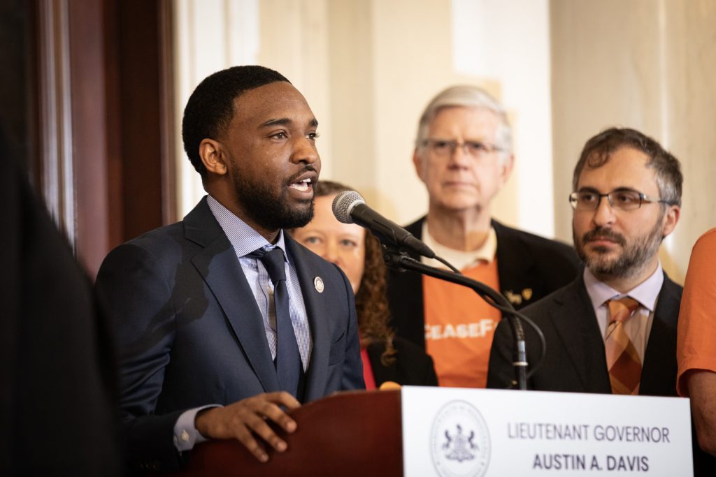 Lt. Gov. Austin Davis, gun safety advocates, and families of victims ...